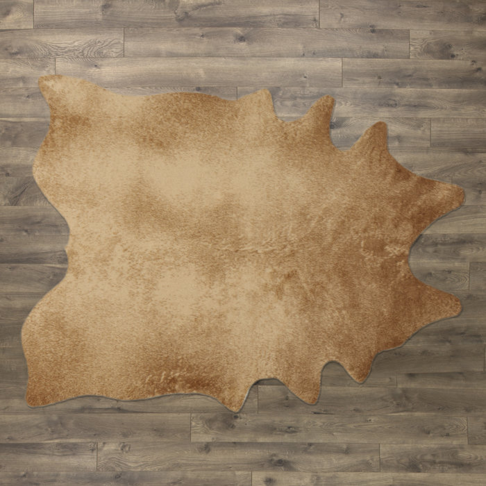 Ebern Designs Isal Faux Cowhide Tan Rug & Reviews | Wayfair