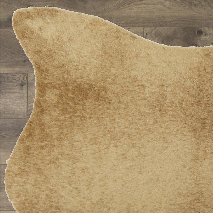 Ebern Designs Isal Faux Cowhide Tan Rug & Reviews | Wayfair